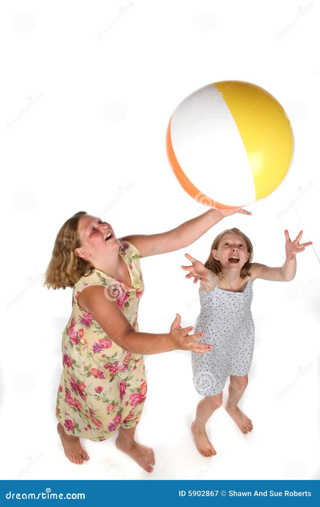 Two Girls Tossing Ball In Air Picture. Image: 5902867