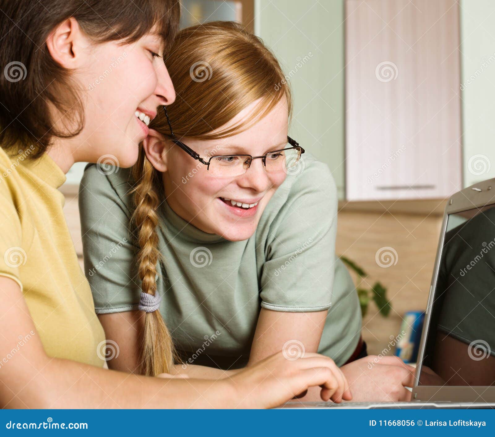 Two Girls Uses Home Computer Stock Photo - Image of female, looking ...