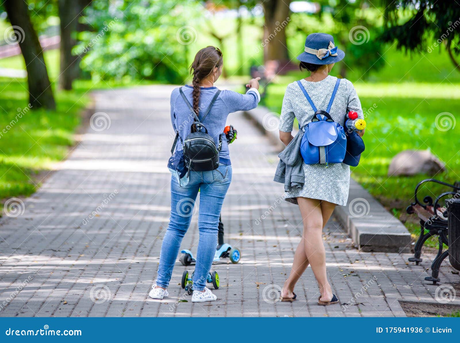 Two Girls Walk Along The Sidewalk On St Jones Bridge Editorial Photo ...