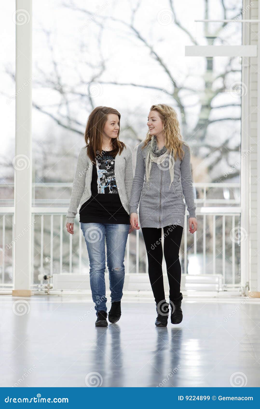Two girls walking stock image. Image of blond, walking - 9224899