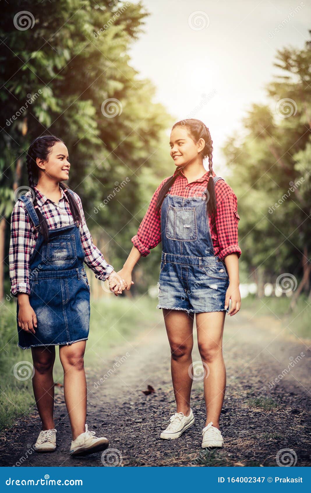 Two Girls Walking Along a Forest Stock Image - Image of park, summer ...