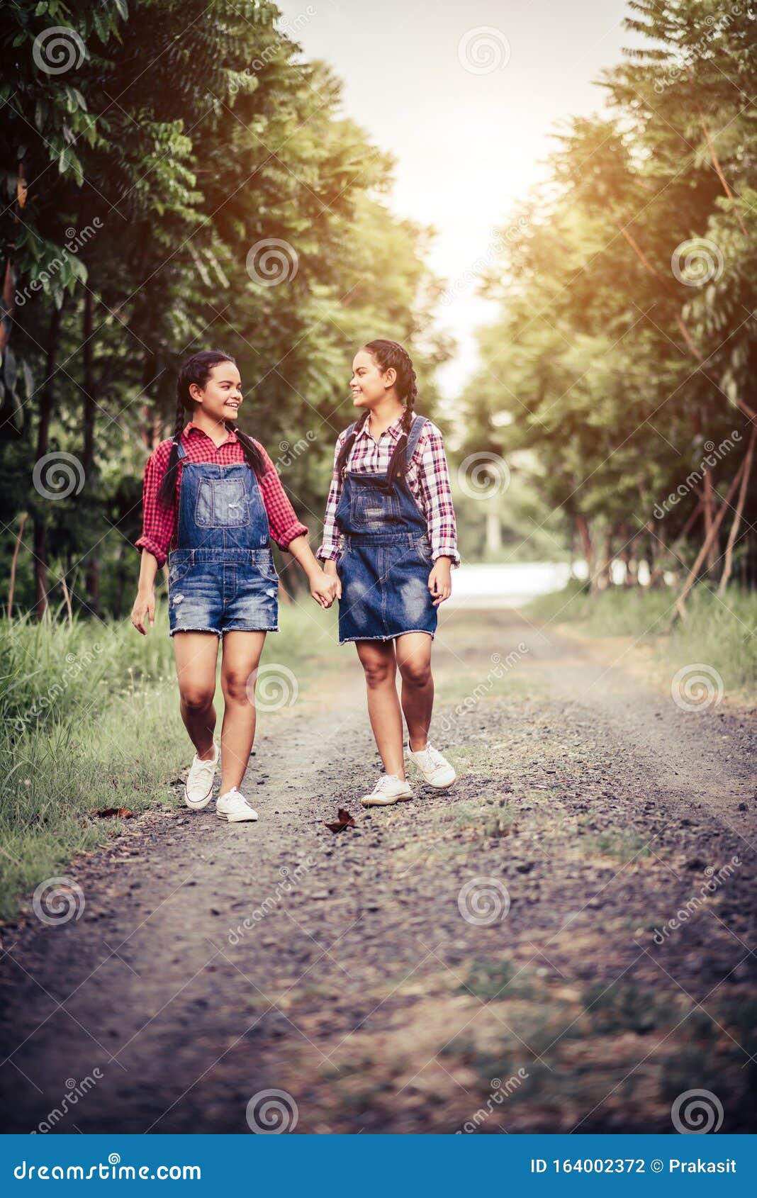 Two Girls Walking Along a Forest Stock Photo - Image of together ...