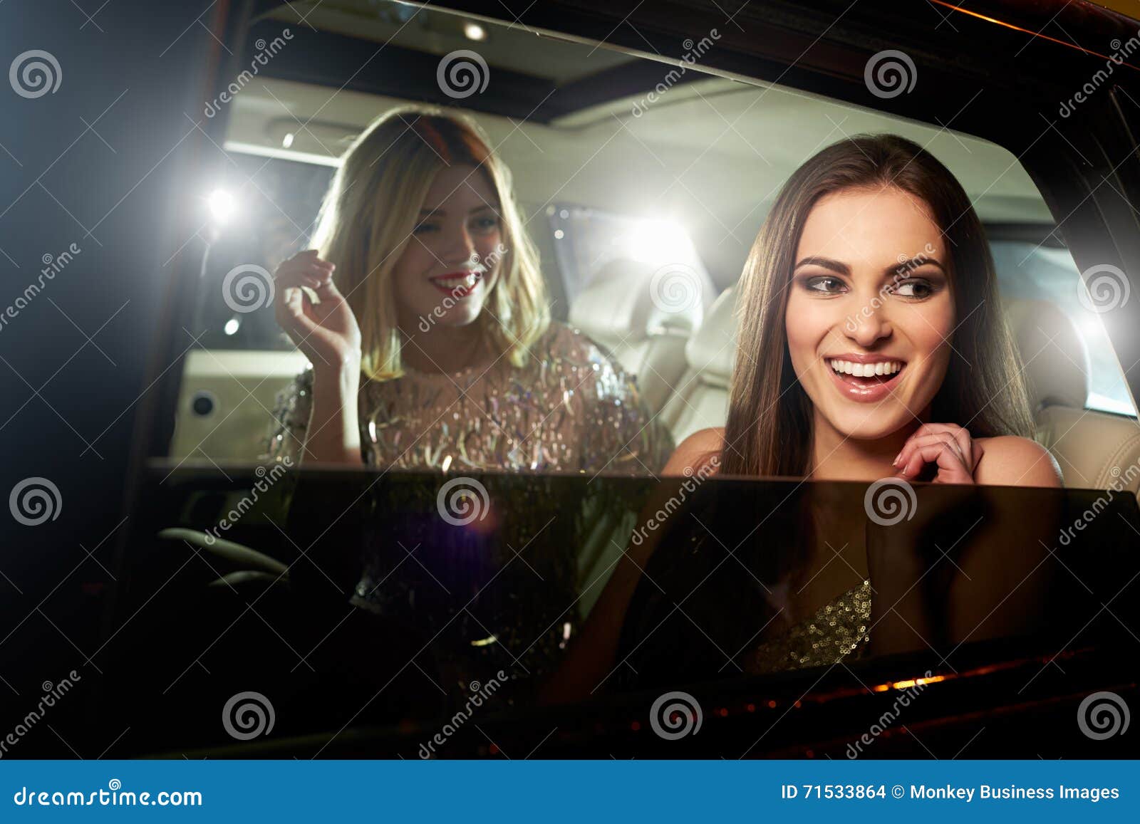 Two Glamorous Women Laughing in the Back of a Limousine Stock Photo ...