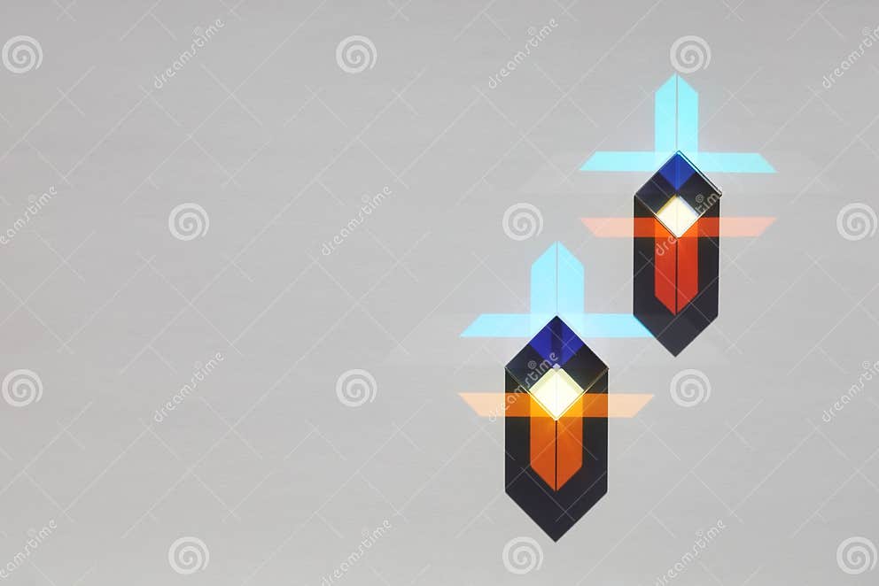 Two Glass Prism Cubes Refract Light and Create a Geometric Pattern ...