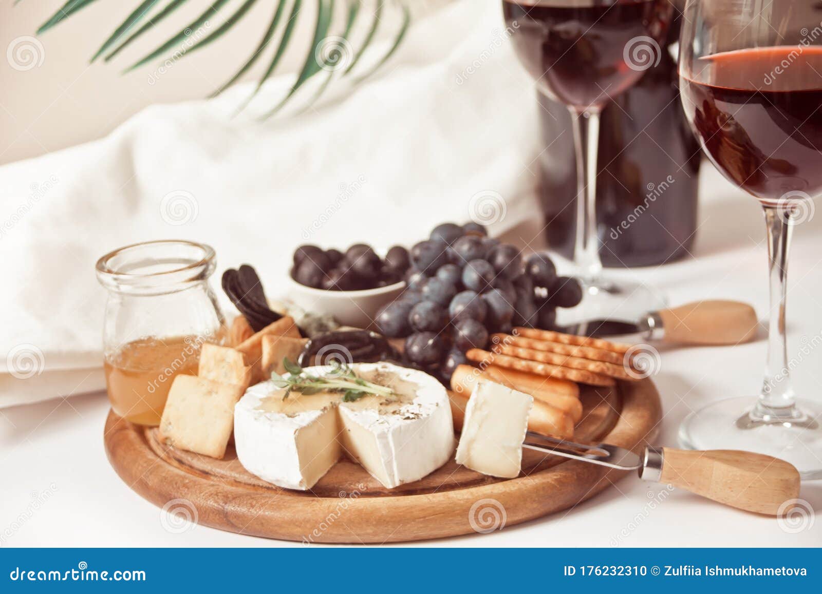 Two Glass of Red Wine and Plate with Assorted Cheese, Fruit and Other ...