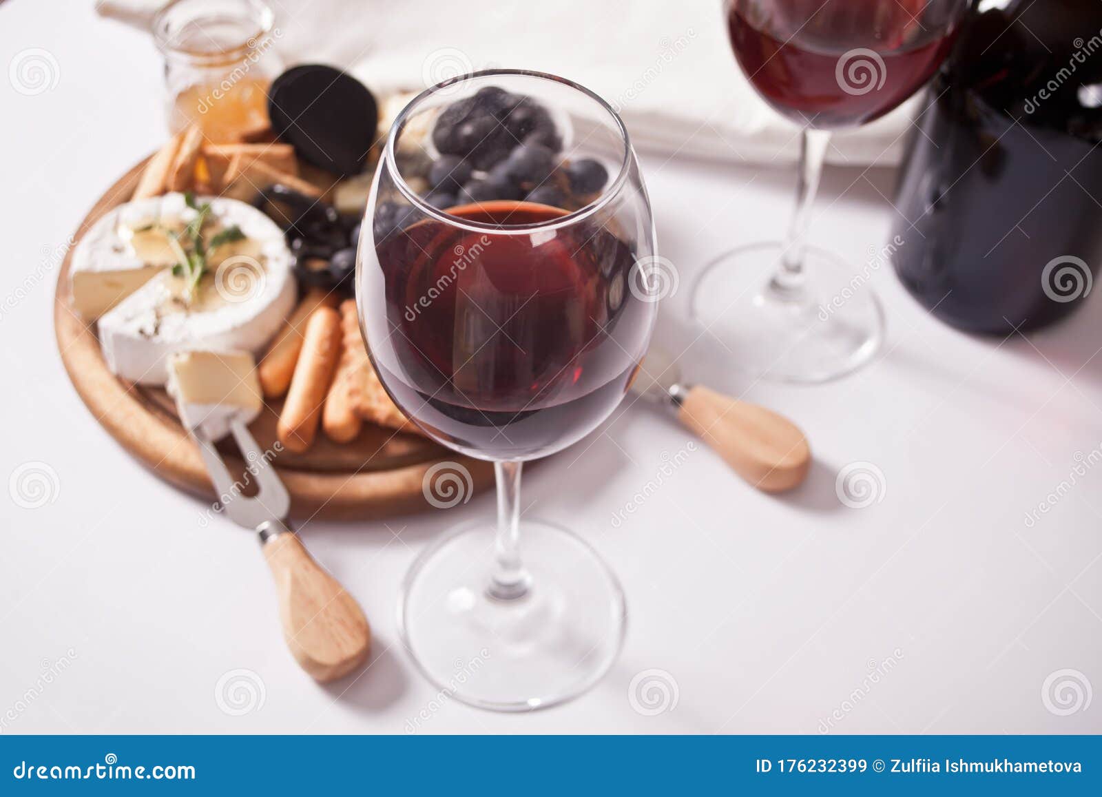 Two Glass of Red Wine and Plate with Assorted Cheese, Fruit and Other ...