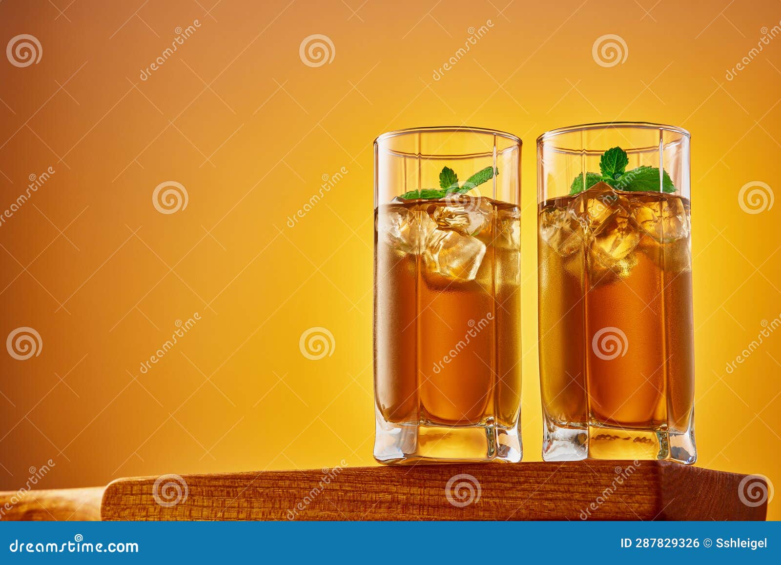 Two Glass of Refreshing Iced Tea with Ice Cubes and Mint Leaves. Studio ...