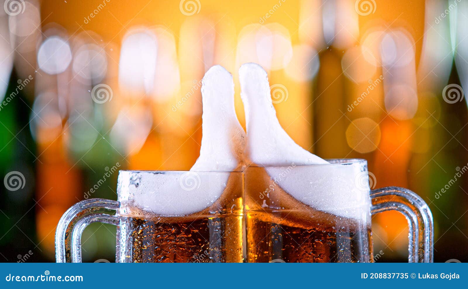 Two Glasses of Beer Toasting Creating Splash. Stock Image - Image of ...