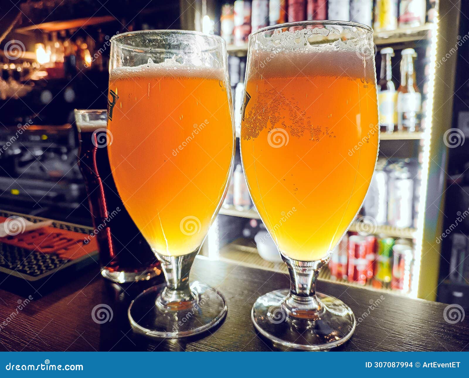 Two Glasses of Cold Foamy Beer on Bar Counter Stock Photo - Image of ...