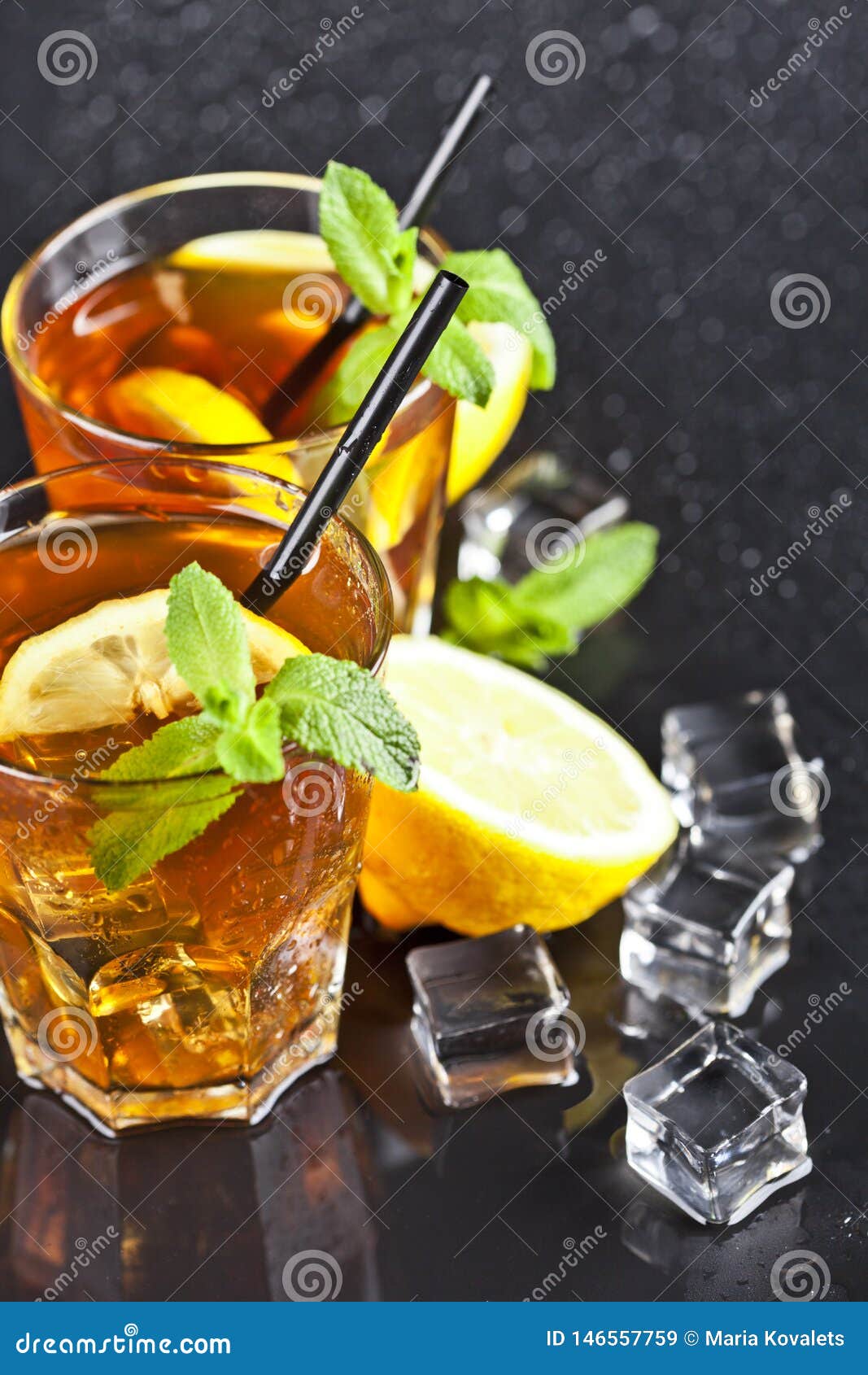 Two Glasses With Cold Traditional Iced Tea With Lemon Mint Leaves And