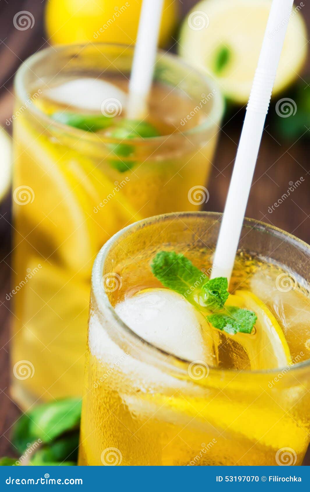 Two Glasses of Ice Tea with Ice-cubes on Wooden Table Stock Photo ...