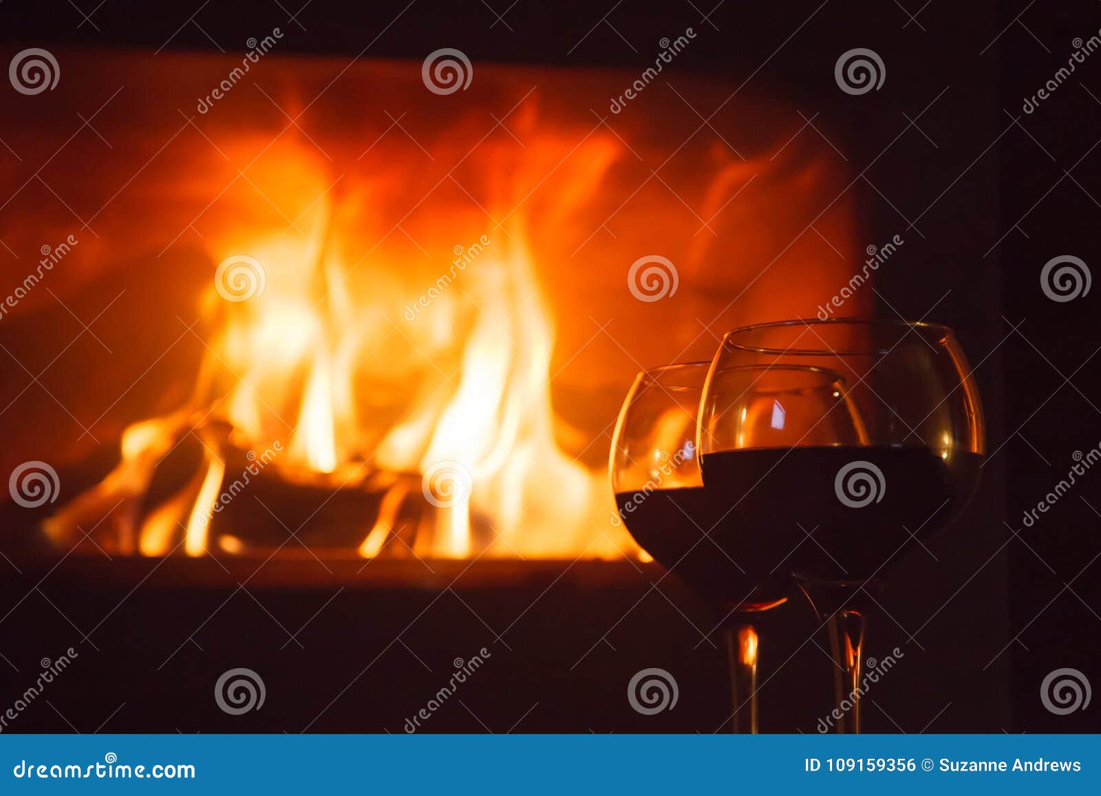Two Glasses of Red Wine in Font of Log Fire Stock Photo - Image of font ...