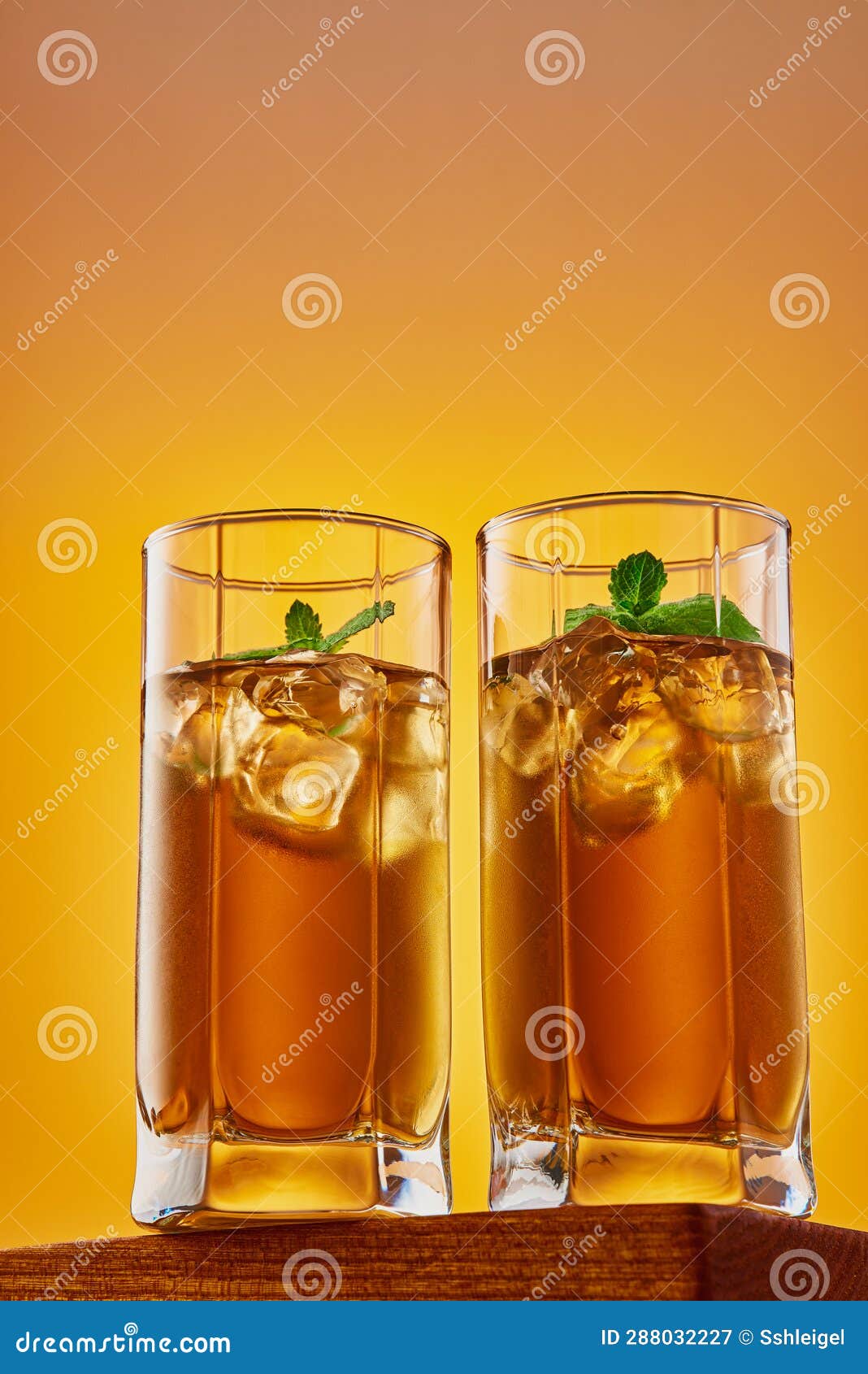 Two Glasses of Refreshing Iced Tea with Ice Cubes and Mint Leaves. Copy ...