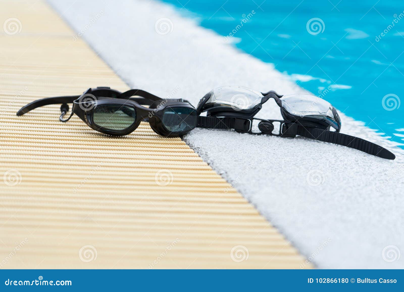 Two Glasses for Swimming Black on Pool Edge Stock Photo - Image of ...