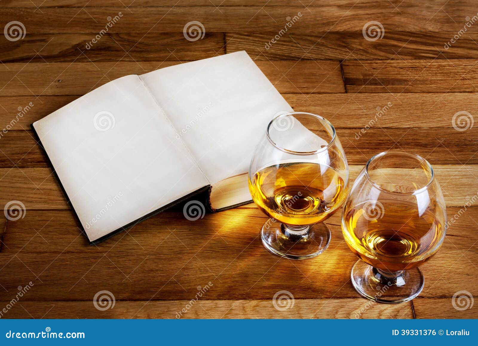 Two Goblets of Brandy and Open Book Stock Photo - Image of concept ...