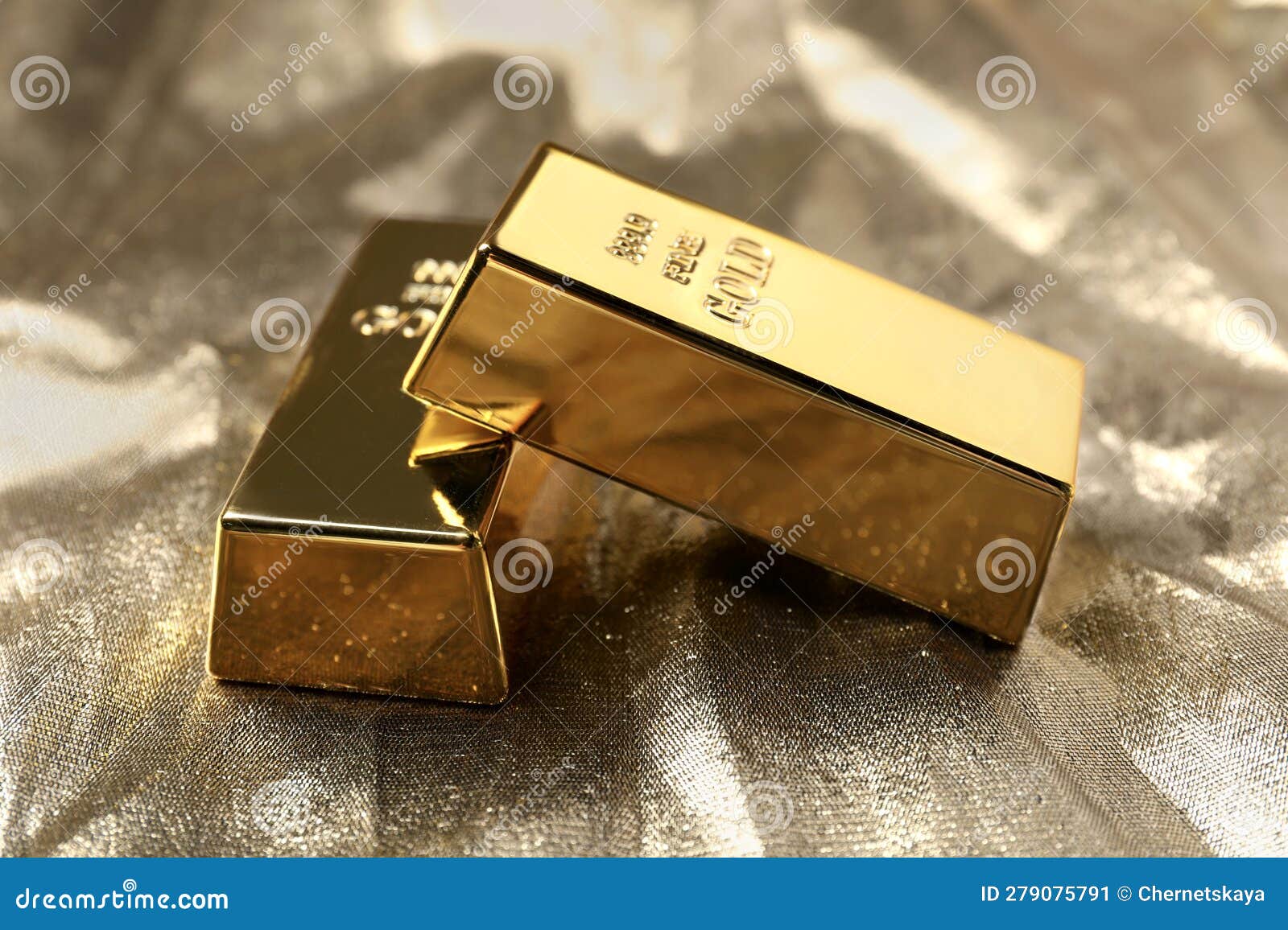 Two Gold Bars on Shiny Fabric, Closeup Stock Image - Image of ...