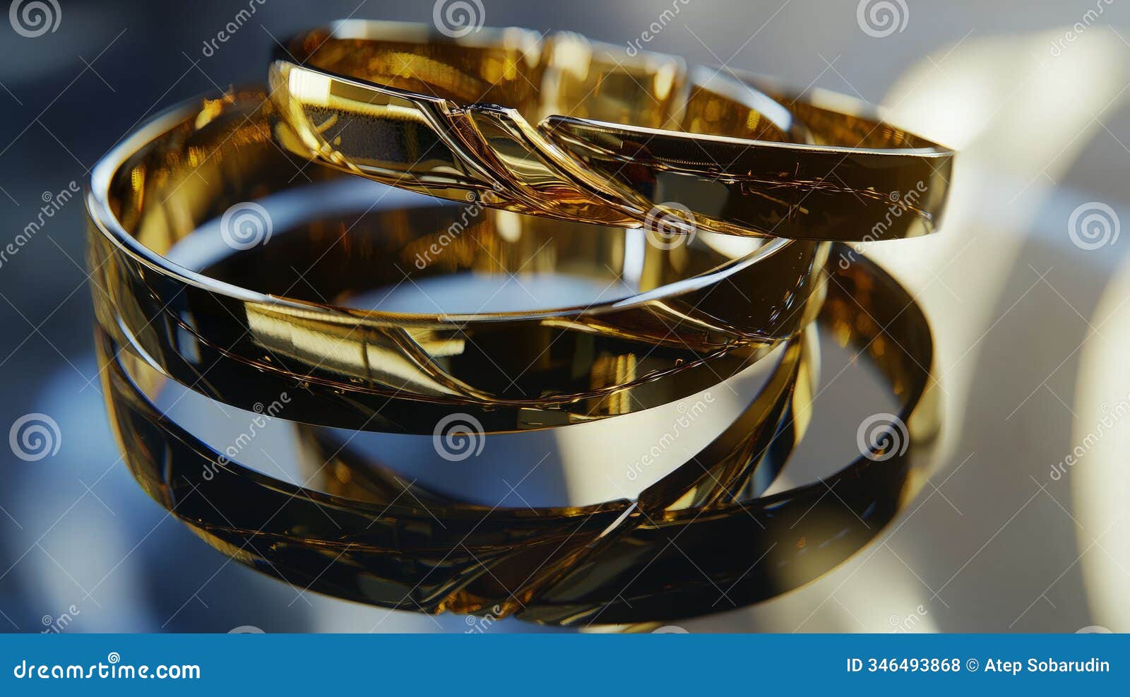 Two Gold Wedding Rings Intertwined, Reflecting on a Dark Surface Stock ...
