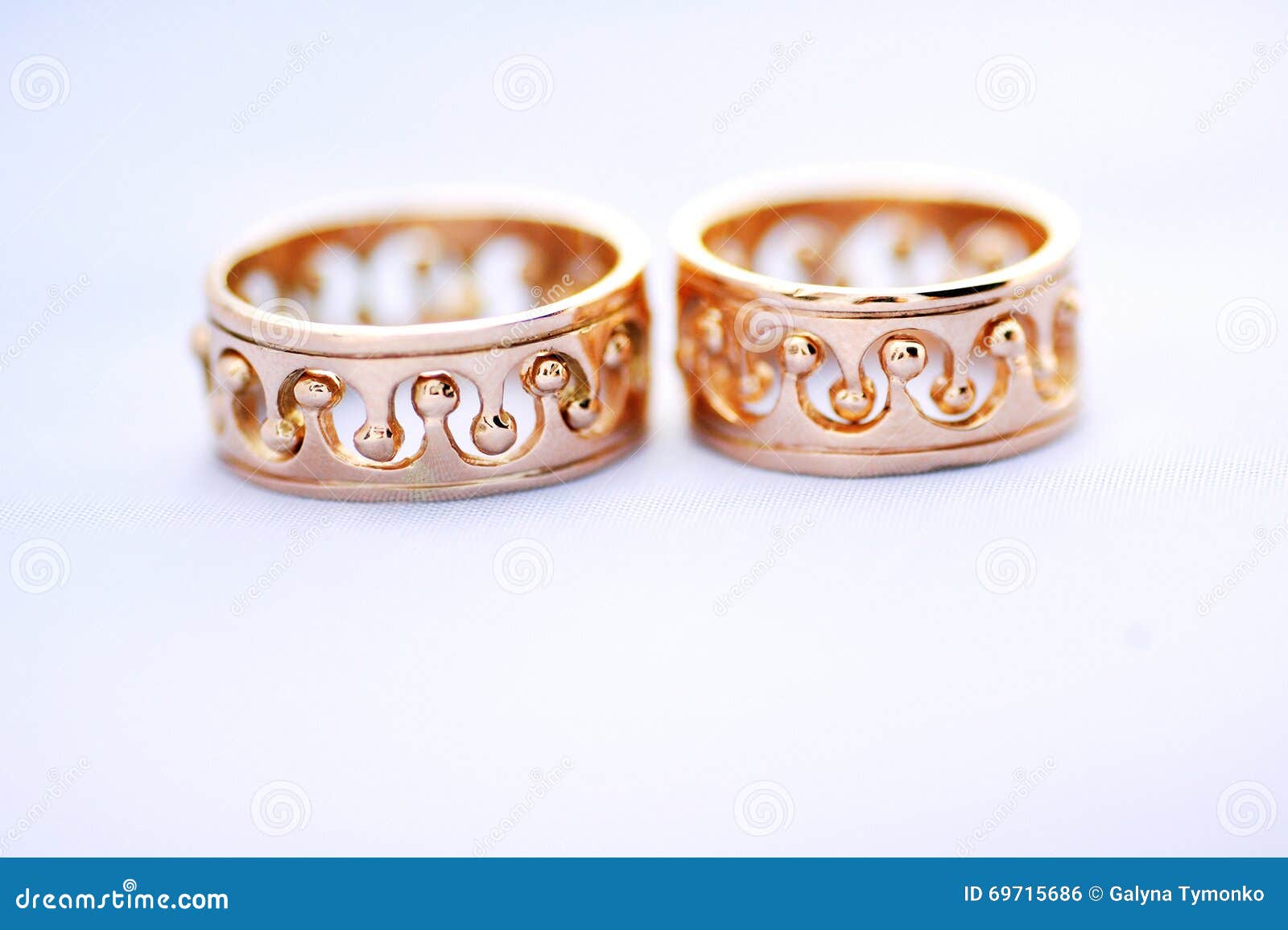 Two Gold Wedding Rings on a White Background Closeup Stock Photo ...