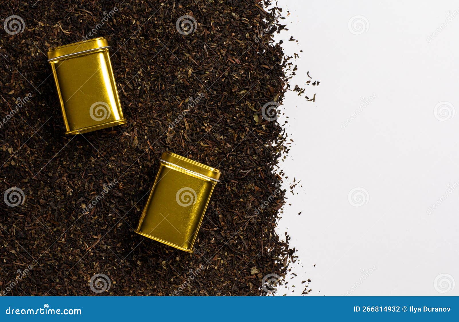 Two Golden Tea Boxes on Black Tea Loose and Copy Space in the Right ...