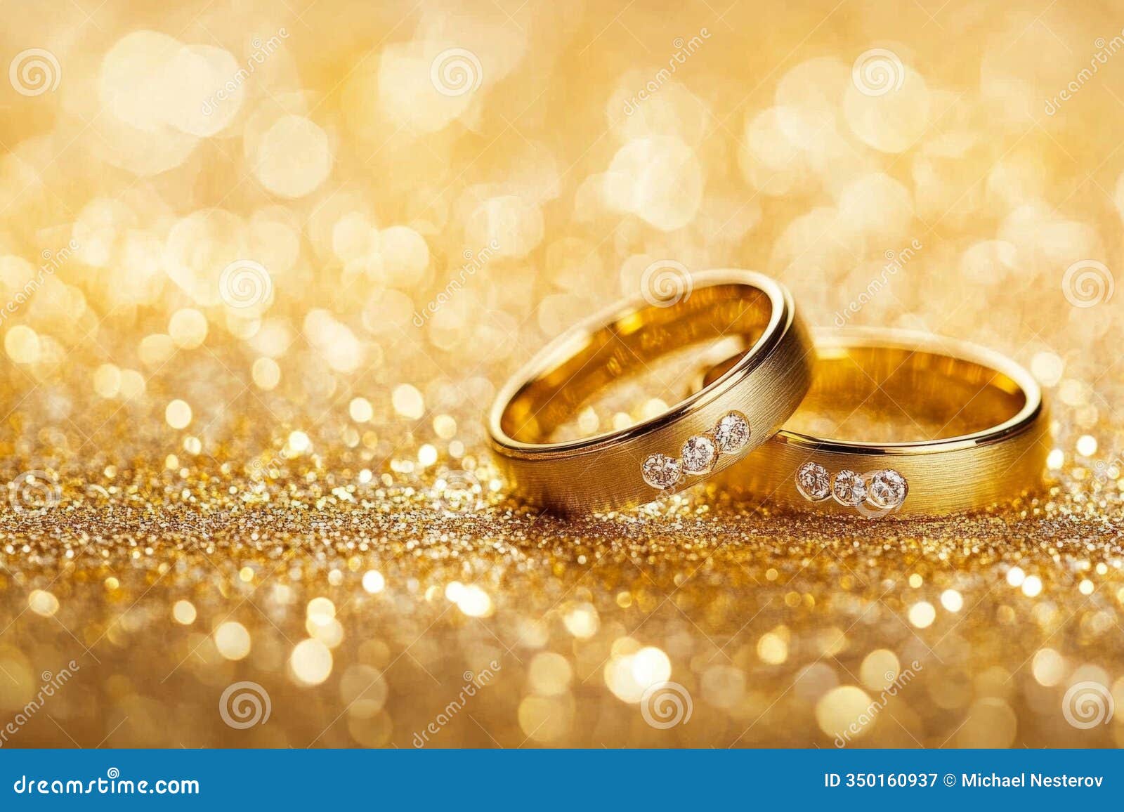 Two Golden Wedding Rings Resting on Sparkling Surface Stock Image ...