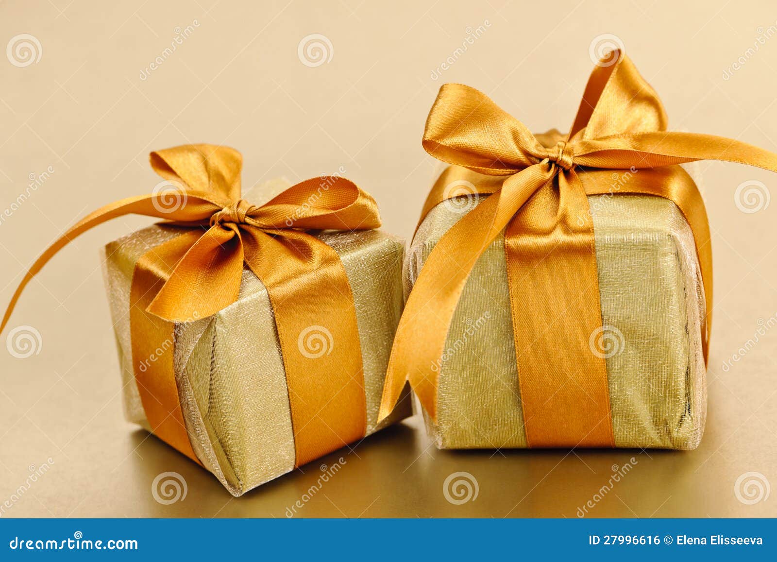 Two Golden Wrapped Gift Boxes Royalty Free Stock Image - Image: 27996616