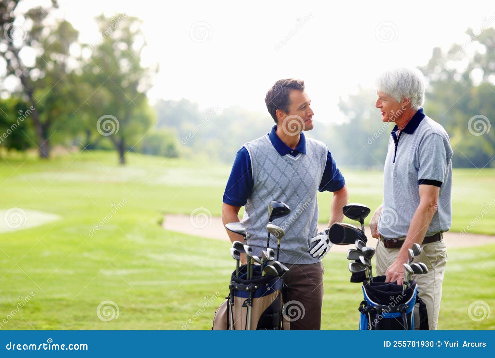 Two Golfers in Discussion. Father and Son Standing on Golf Course and ...