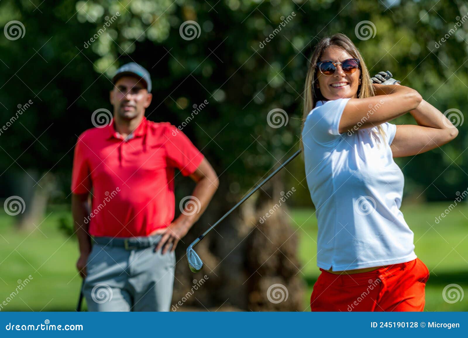 Two Golfers, Female and Male Playing Golf Stock Photo - Image of female ...