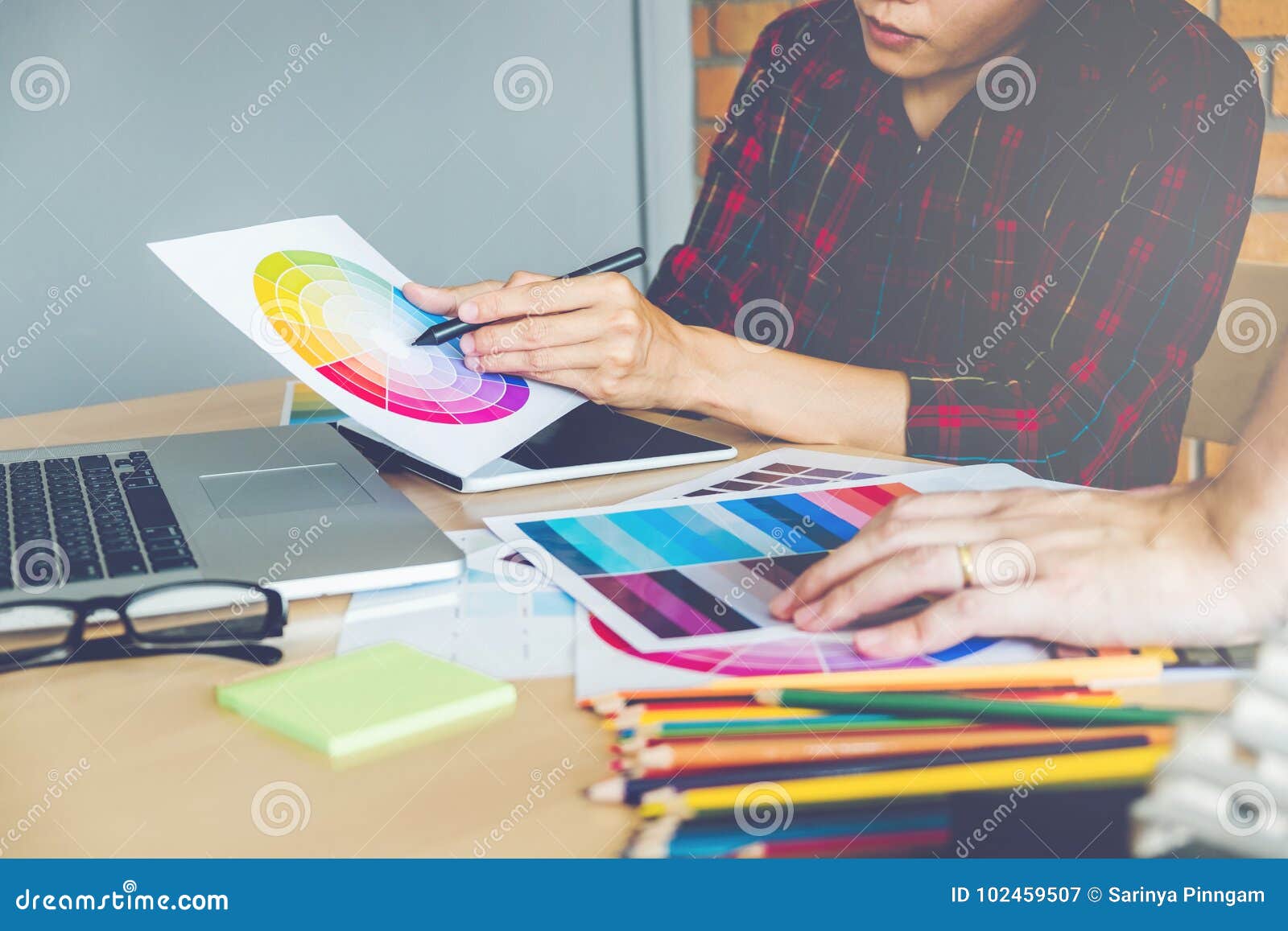 Two Graphic Designer Drawing on Graphics Tablet and Color Palette Guide ...