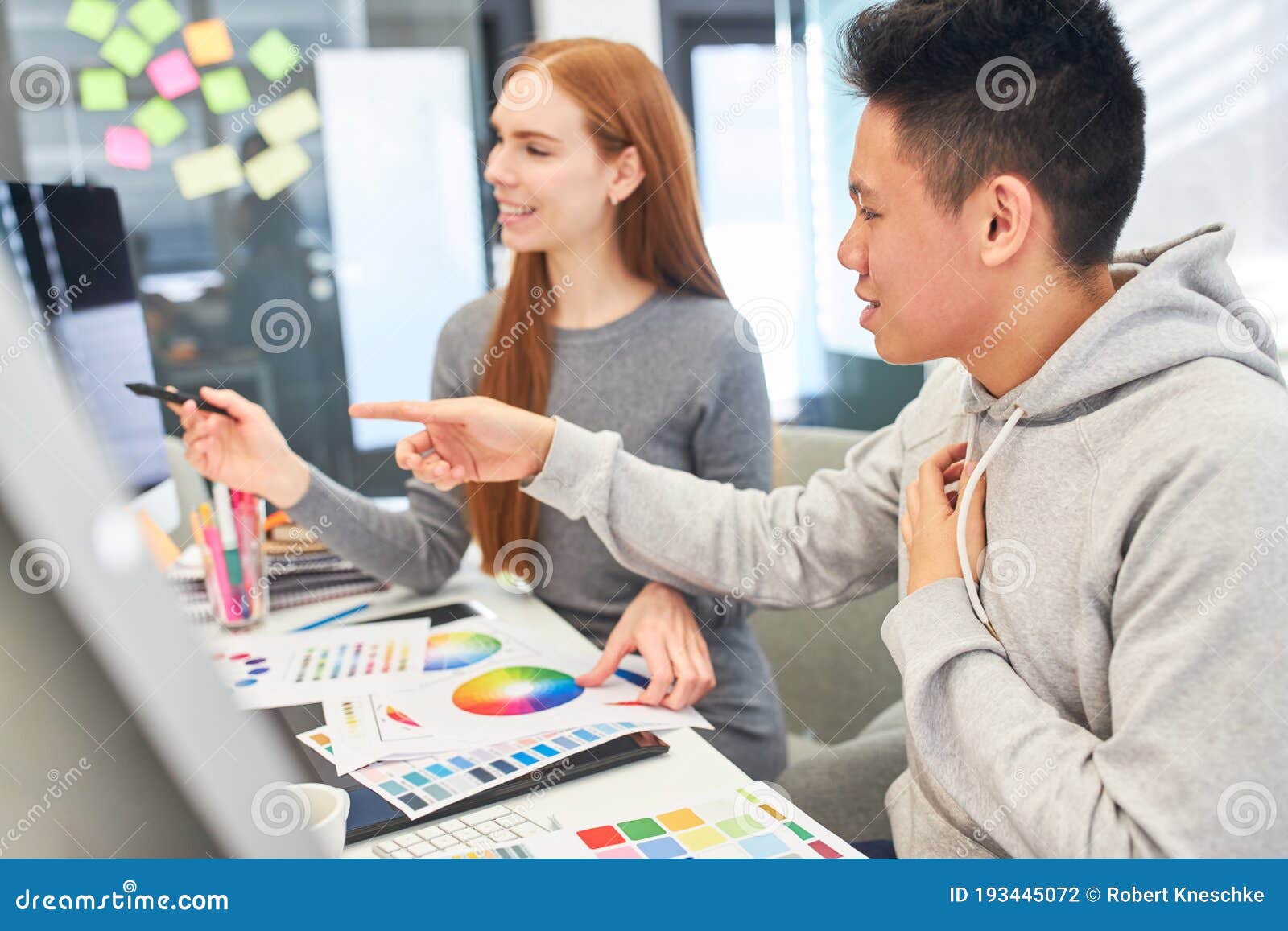 Two Graphic Designers Find a Color Design Solution Stock Photo - Image ...