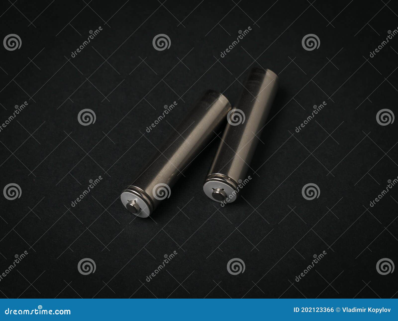 Two Gray AA Batteries on a Black Background. Stock Photo - Image of ...