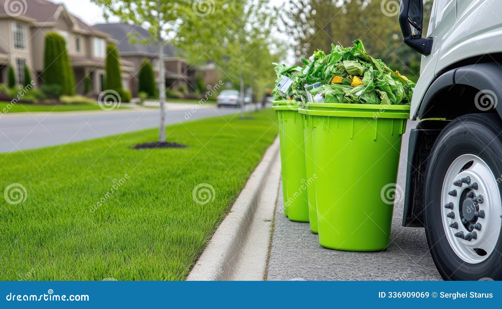 Two Green Trash Cans Sitting Next To a White Van on the Side of the ...