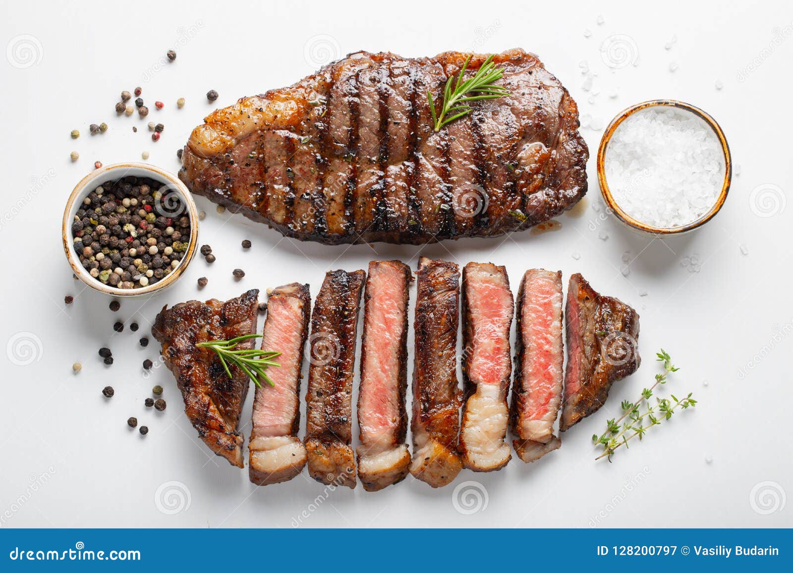 Two Grilled Marbled Beef Steaks Striploin with Spices Isolated on White ...