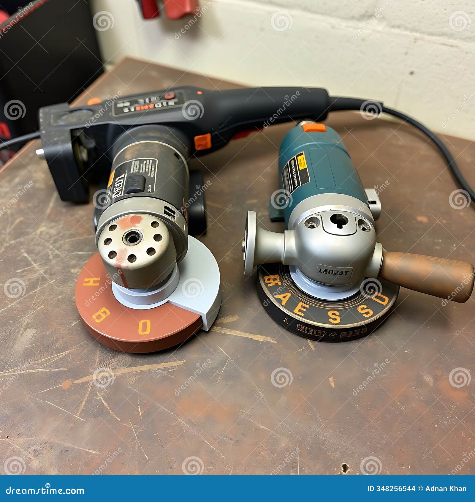 Two Grinding Tools Side by Side One Electric and One Manual Resting on ...