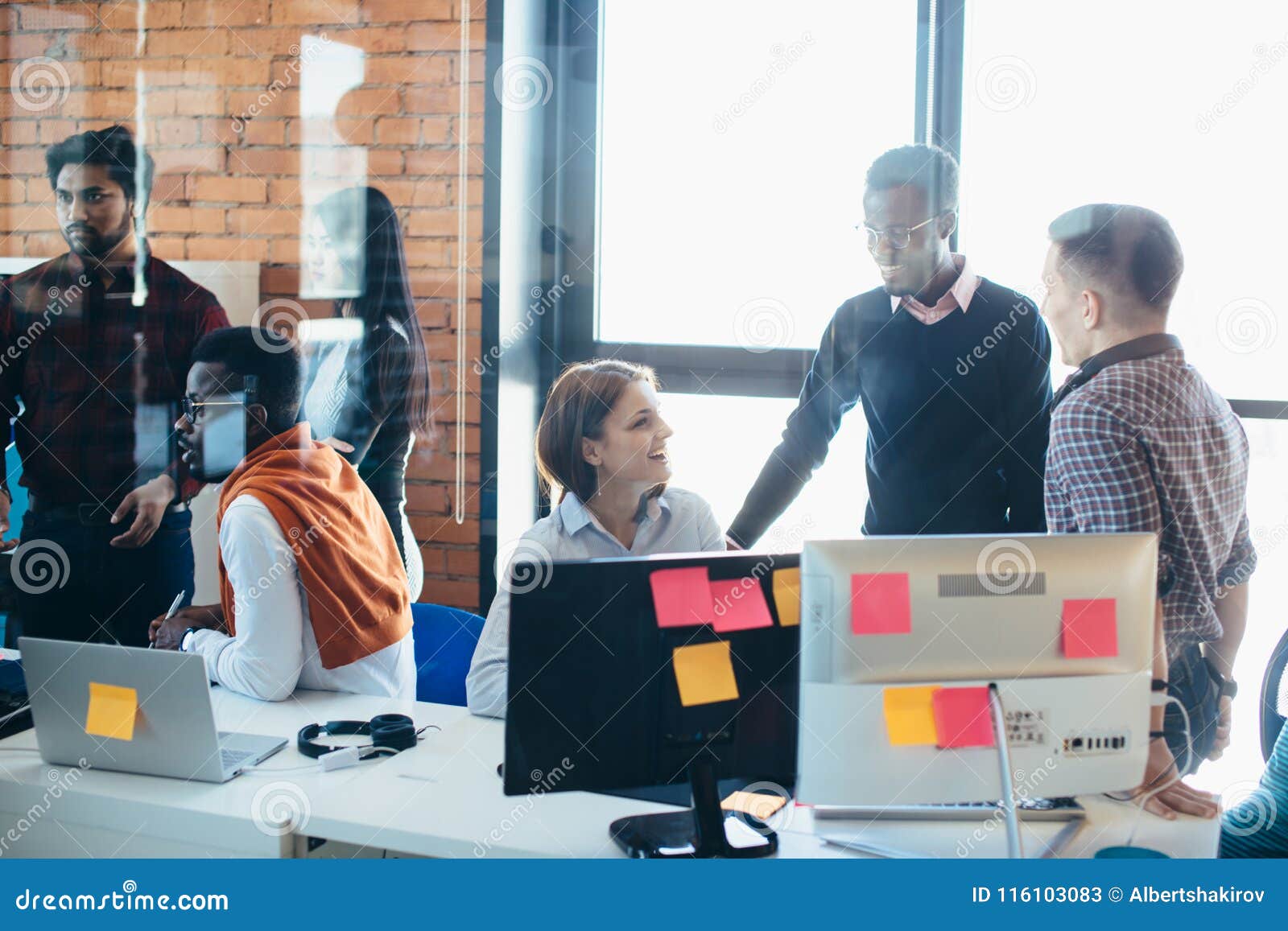 Two Groups of Workers Sitting Back To Back and Working Stock Image ...