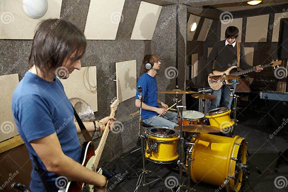 Two Guitarists and Drummer Working in Studio Stock Image - Image of ...