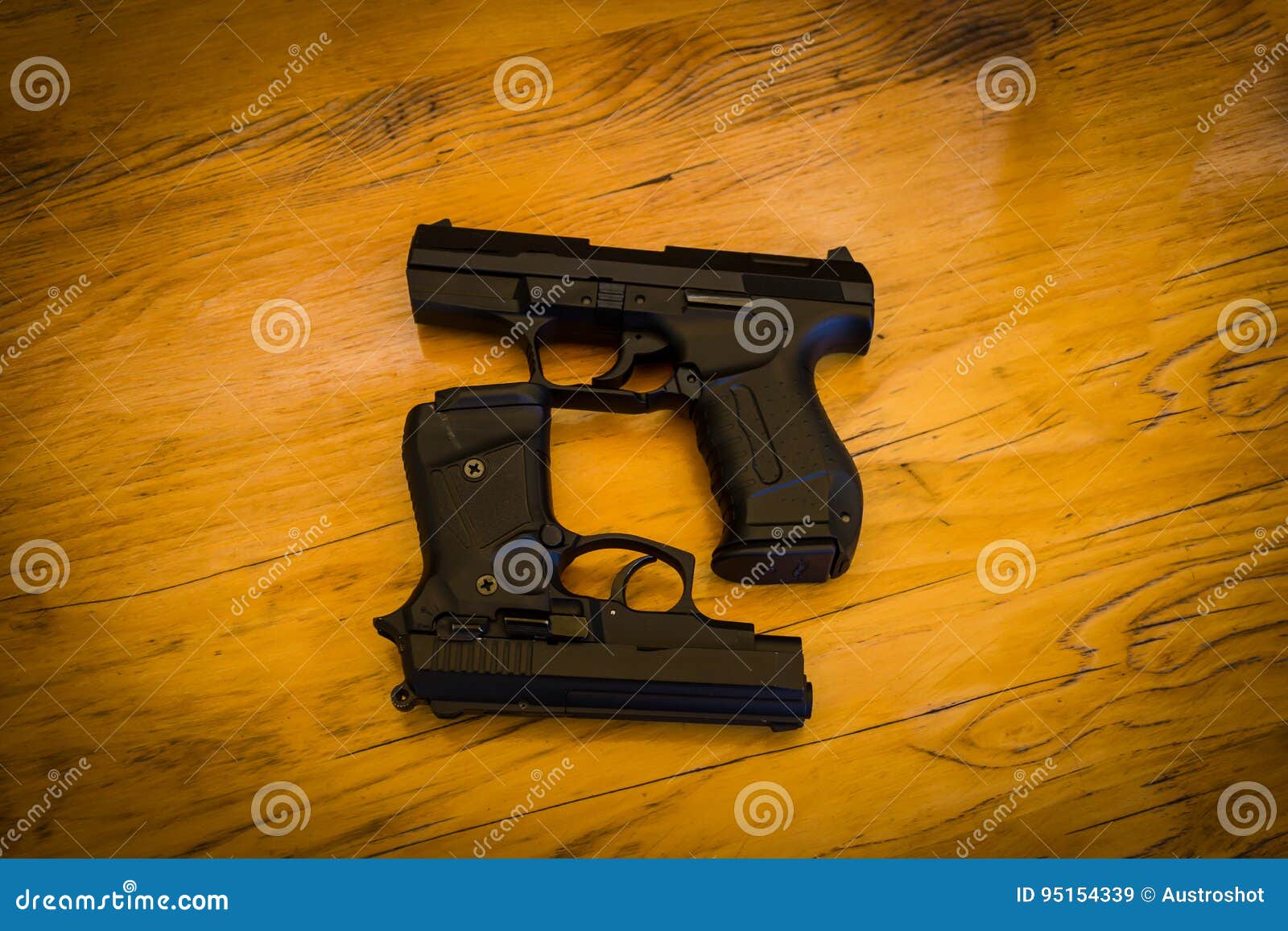 Two guns on a wooden table stock image. Image of violence - 95154339