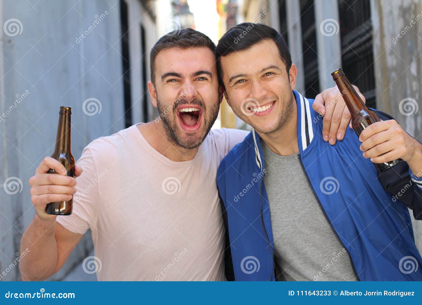 Two Guys Cheering with a Cold Refreshing Beer Outdoors Stock Image ...