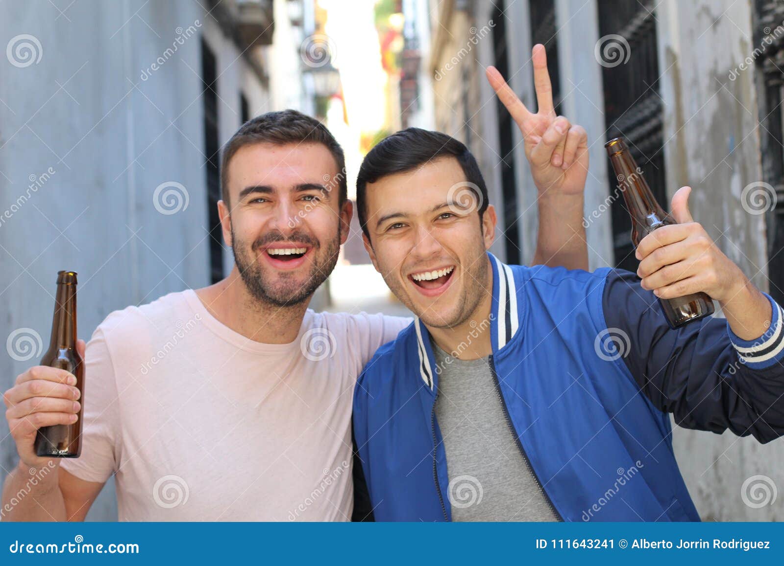Two Guys Cheering with a Cold Refreshing Beer Outdoors Stock Image ...