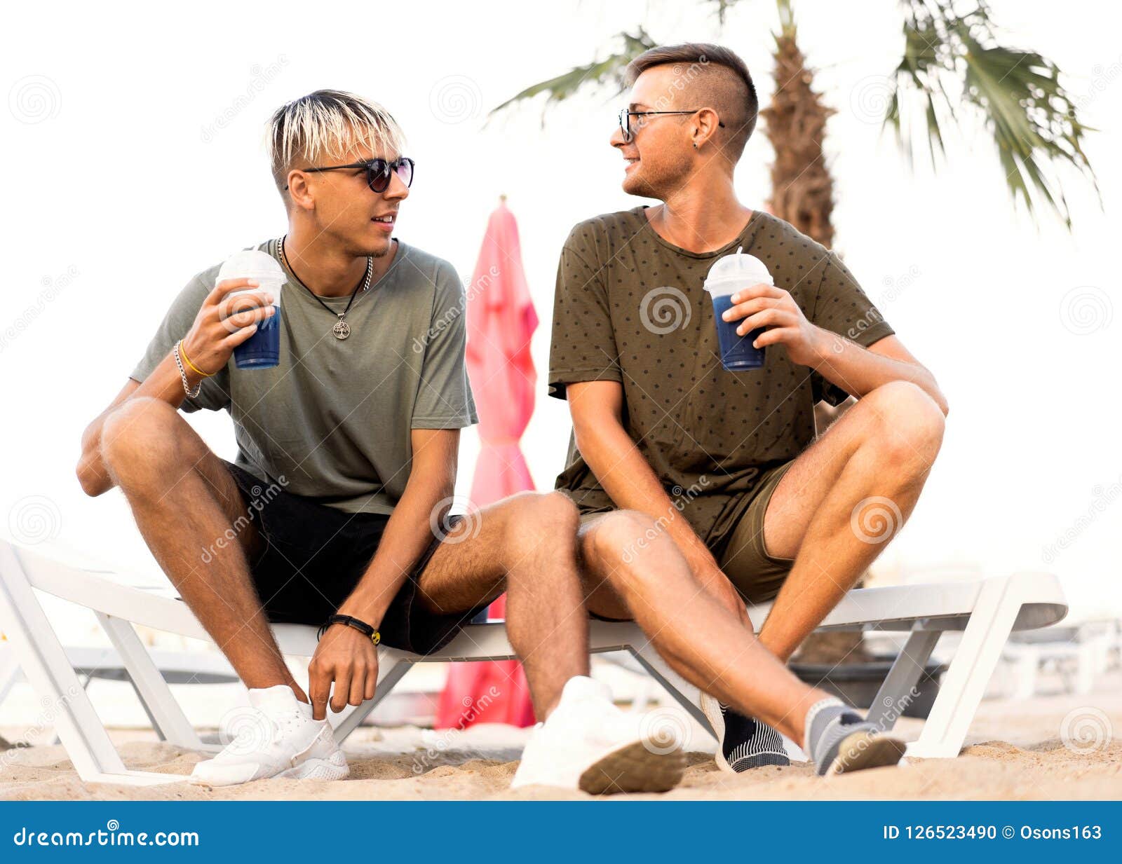 Two Guys Drink Cocktails on a Tropical Beach Stock Photo - Image of ...
