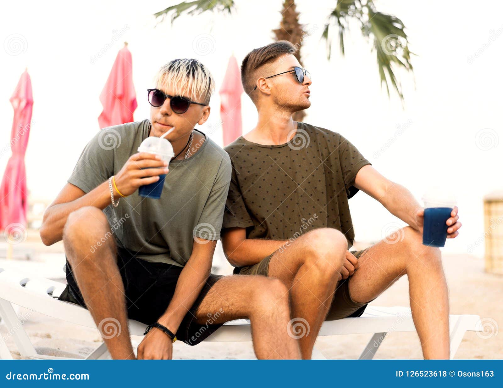 Two Guys Drink Cocktails on a Tropical Beach Stock Photo - Image of ...