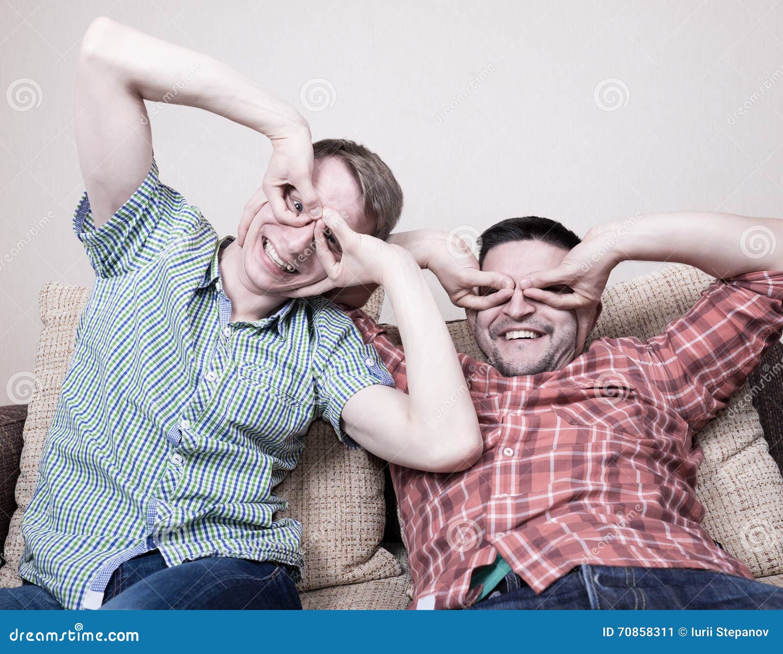 Two Guys with Funny Gestures Stock Image - Image of smile, watching ...