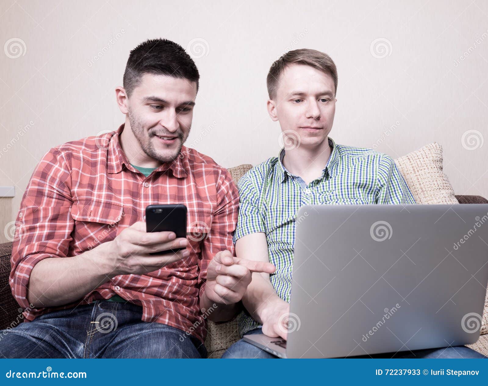 Two guys with gadgets stock image. Image of handsome - 72237933