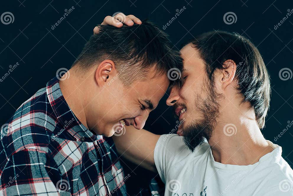 Two Guys Hugging on a Dark Background Stock Image - Image of fingers ...