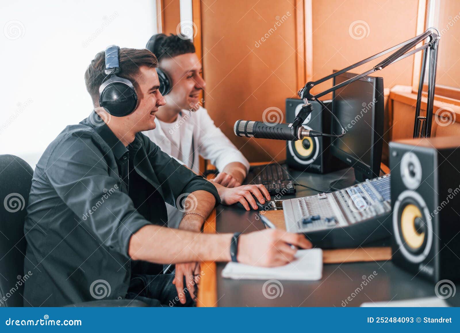 Two Guys is Indoors in the Radio Studio is Busy by Broadcast Stock ...