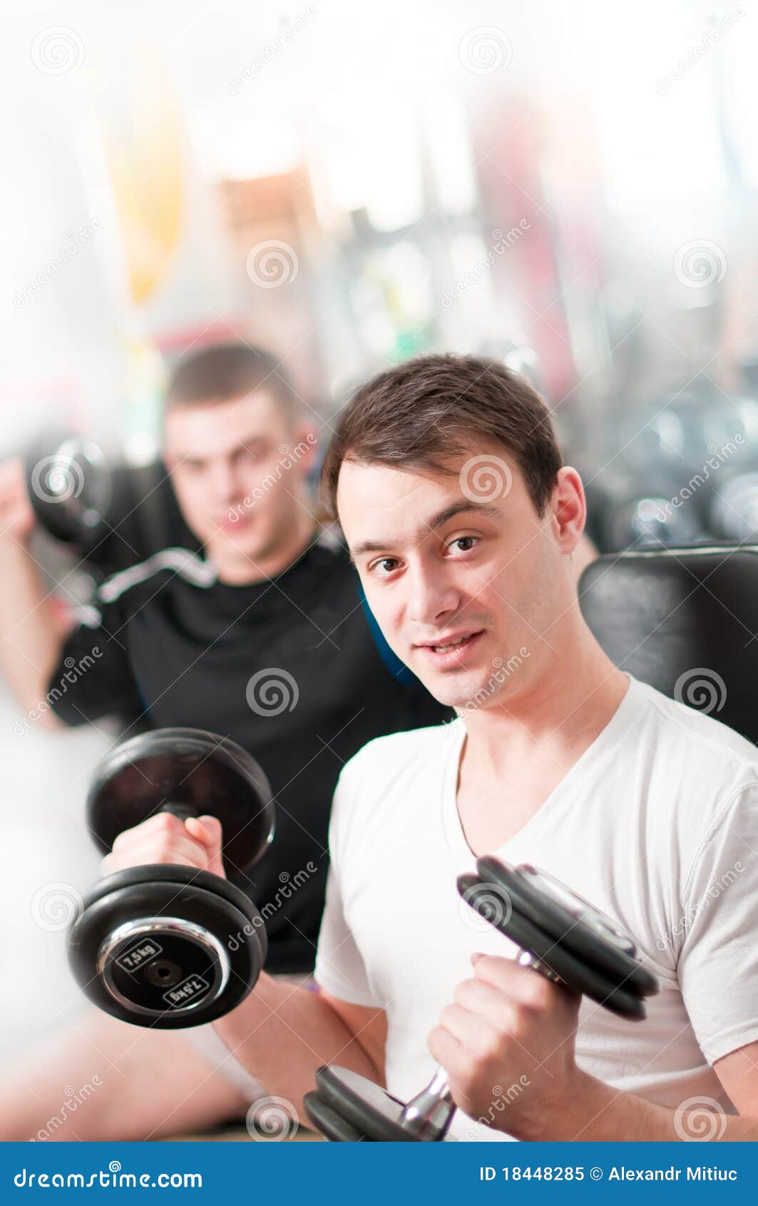Two Guys Lifting Heavy Dumbbells Stock Image - Image of muscle, lifting ...
