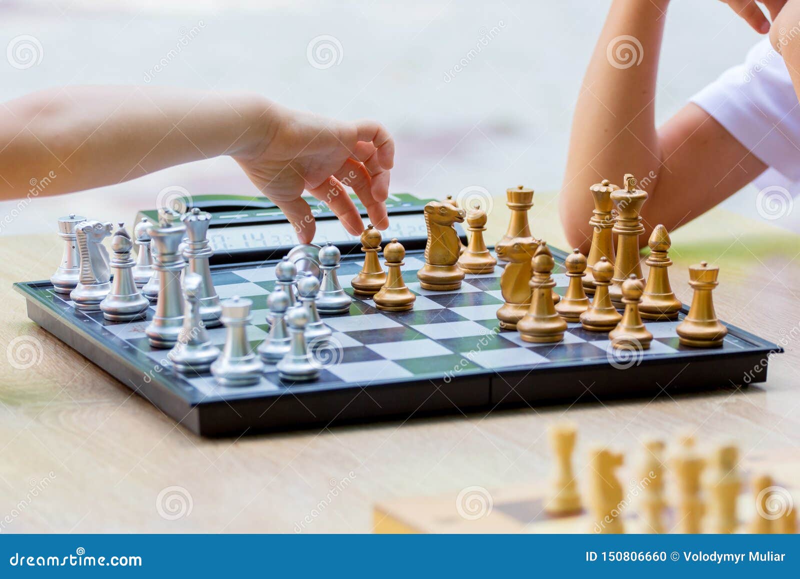 Two Guys are Playing Chess, the Boy Rearranges the Chess Piece_ Stock ...