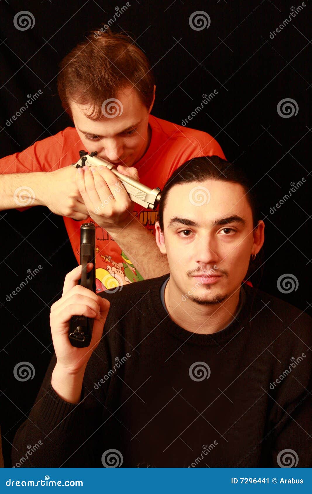 Two guys playing with gun stock image. Image of shirt - 7296441