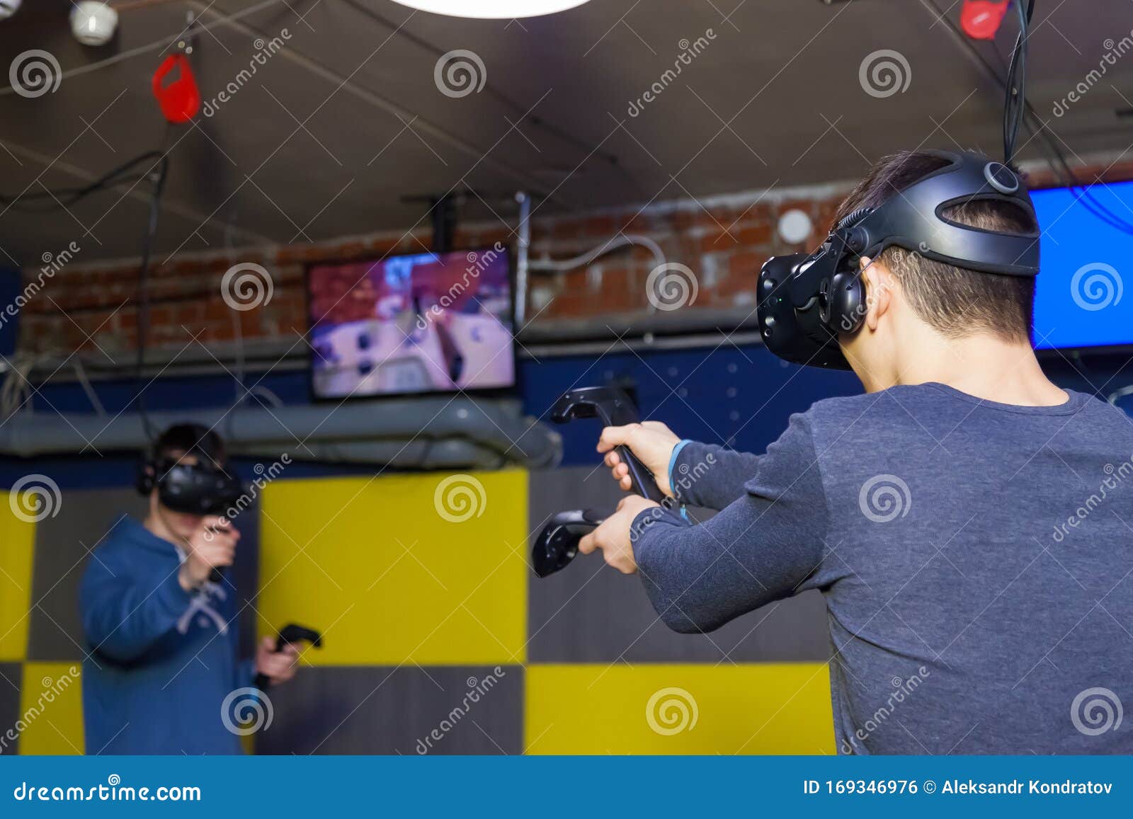 Two Guys Plays a Fight Connected To Virtual Reality in a Helmet with ...