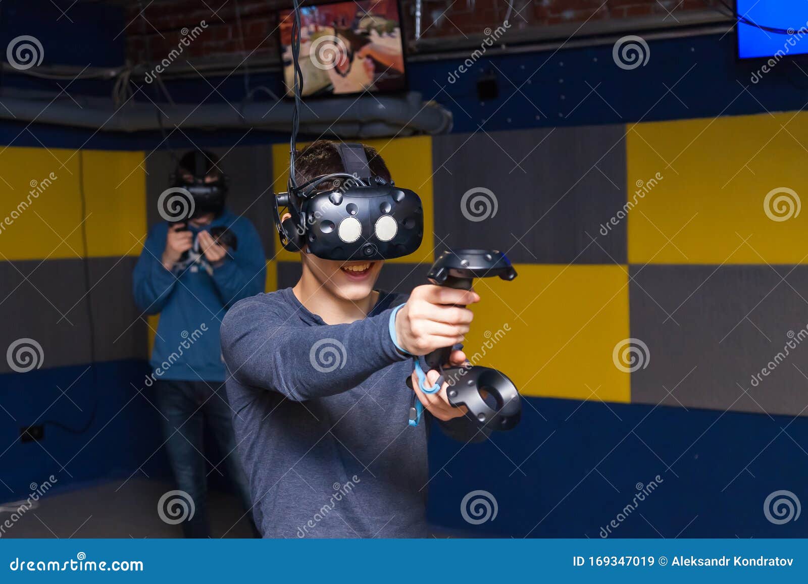 Two Guys Plays a Fight Connected To Virtual Reality in a Helmet with ...