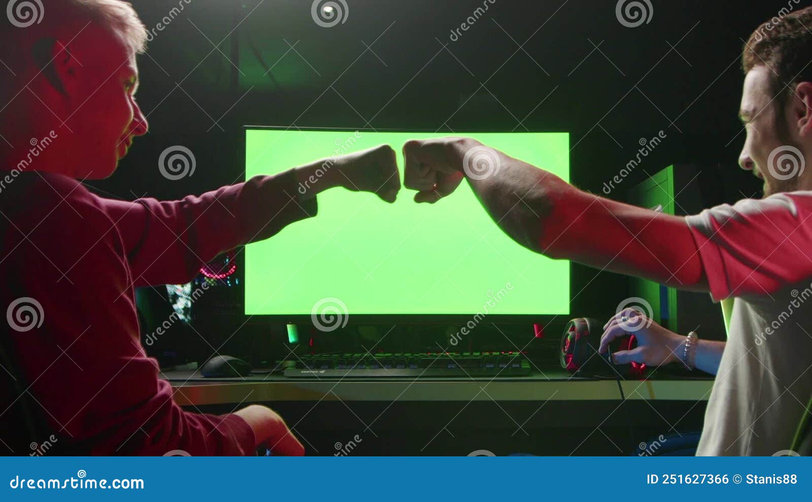 Two Guys are Sitting at a Computer and Looking at a Green Screen Stock ...